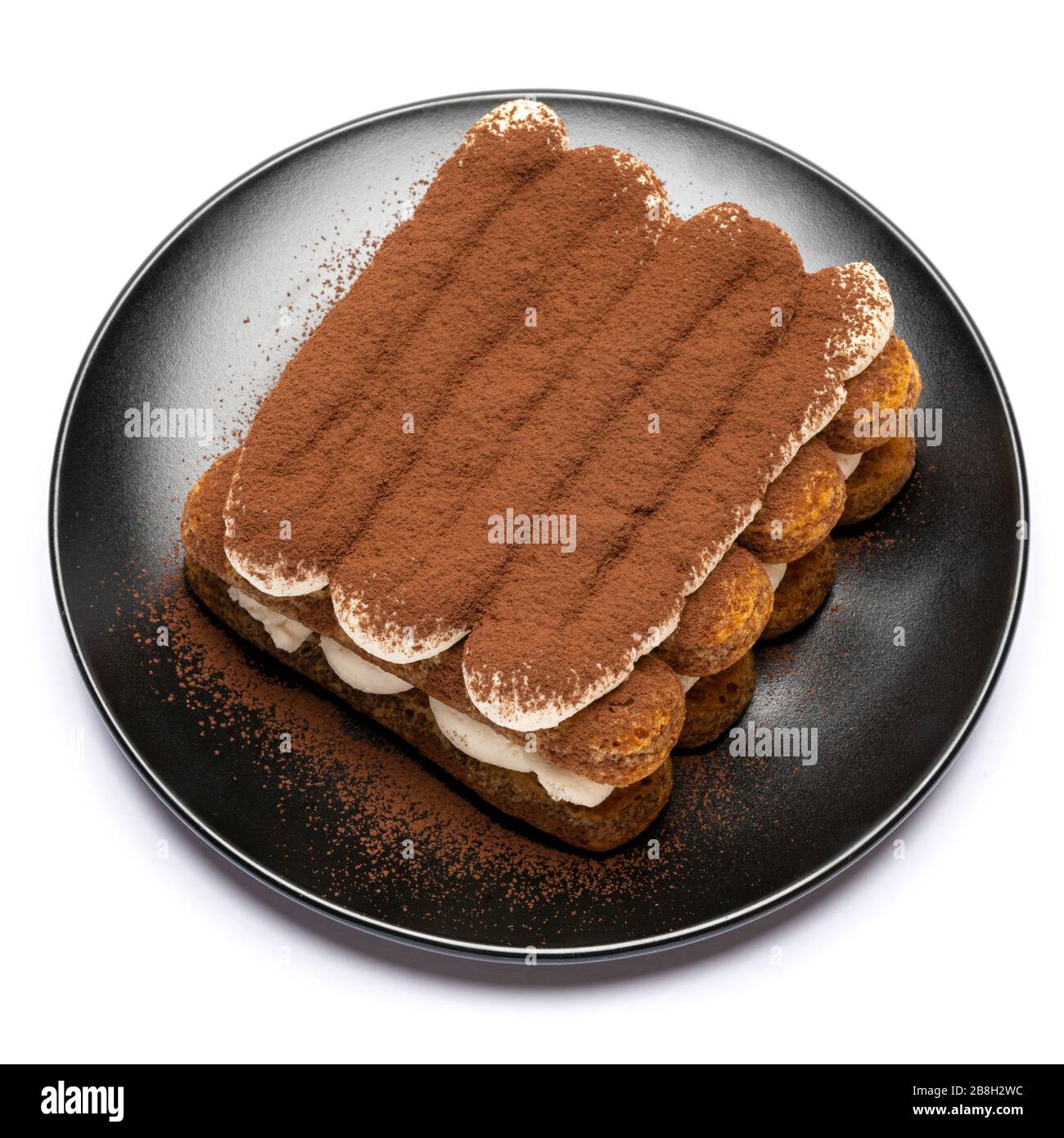 Classic tiramisu dessert on ceramic plate isolated on white background ...