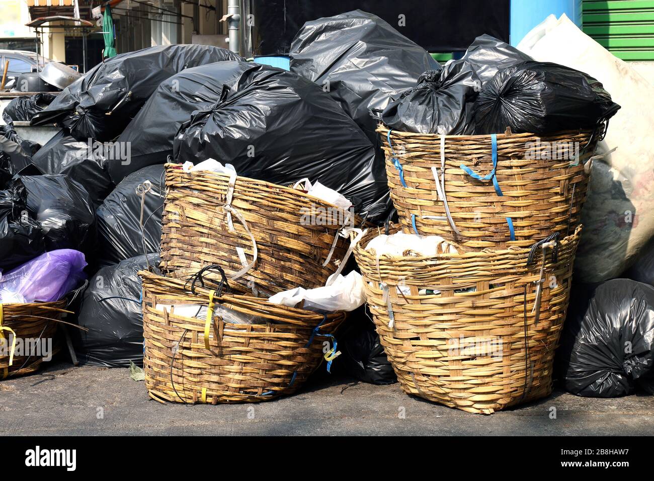 waste plastic junk in basket, pile garbage bamboo rattan baskets bags ...