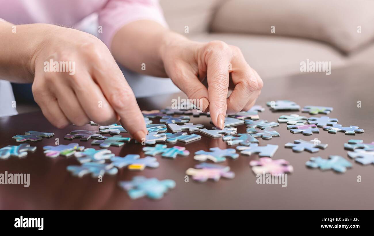Mature woman jigsaw puzzle hi-res stock photography and images - Alamy