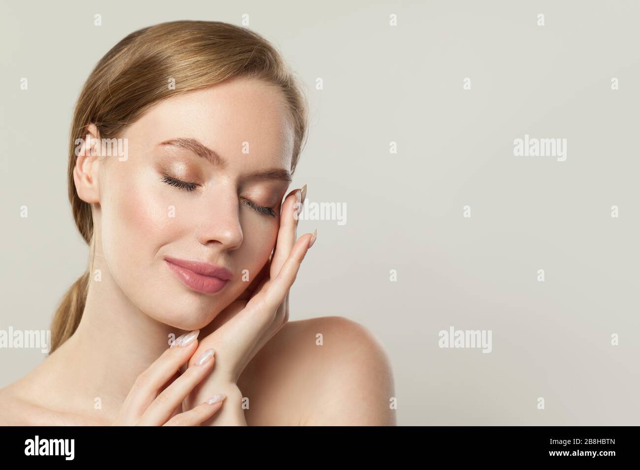 Young perfect model girl with clear skin on white Stock Photo - Alamy
