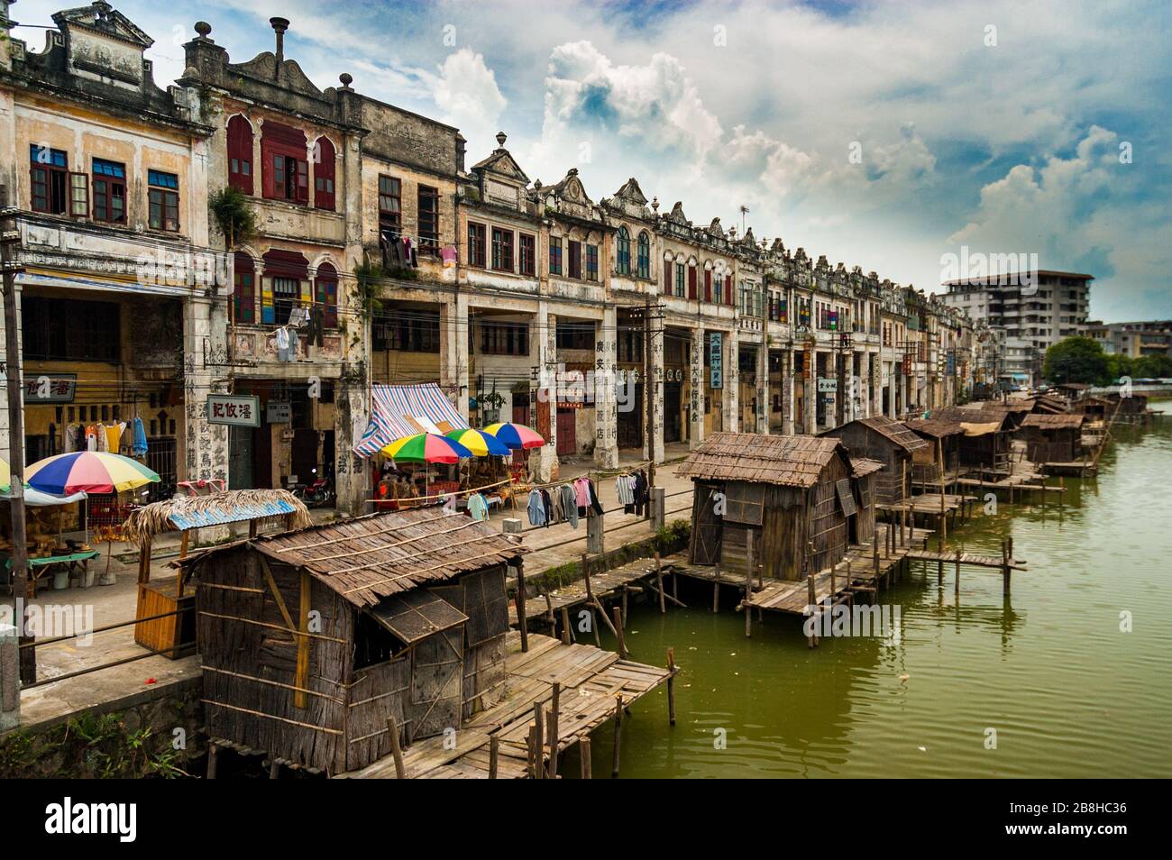 Traditional qilou buildings, which house both shops and homes line the ...