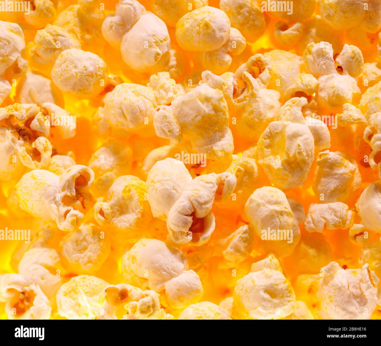Pile of fresh popcorn filling the frame against bright light Stock ...