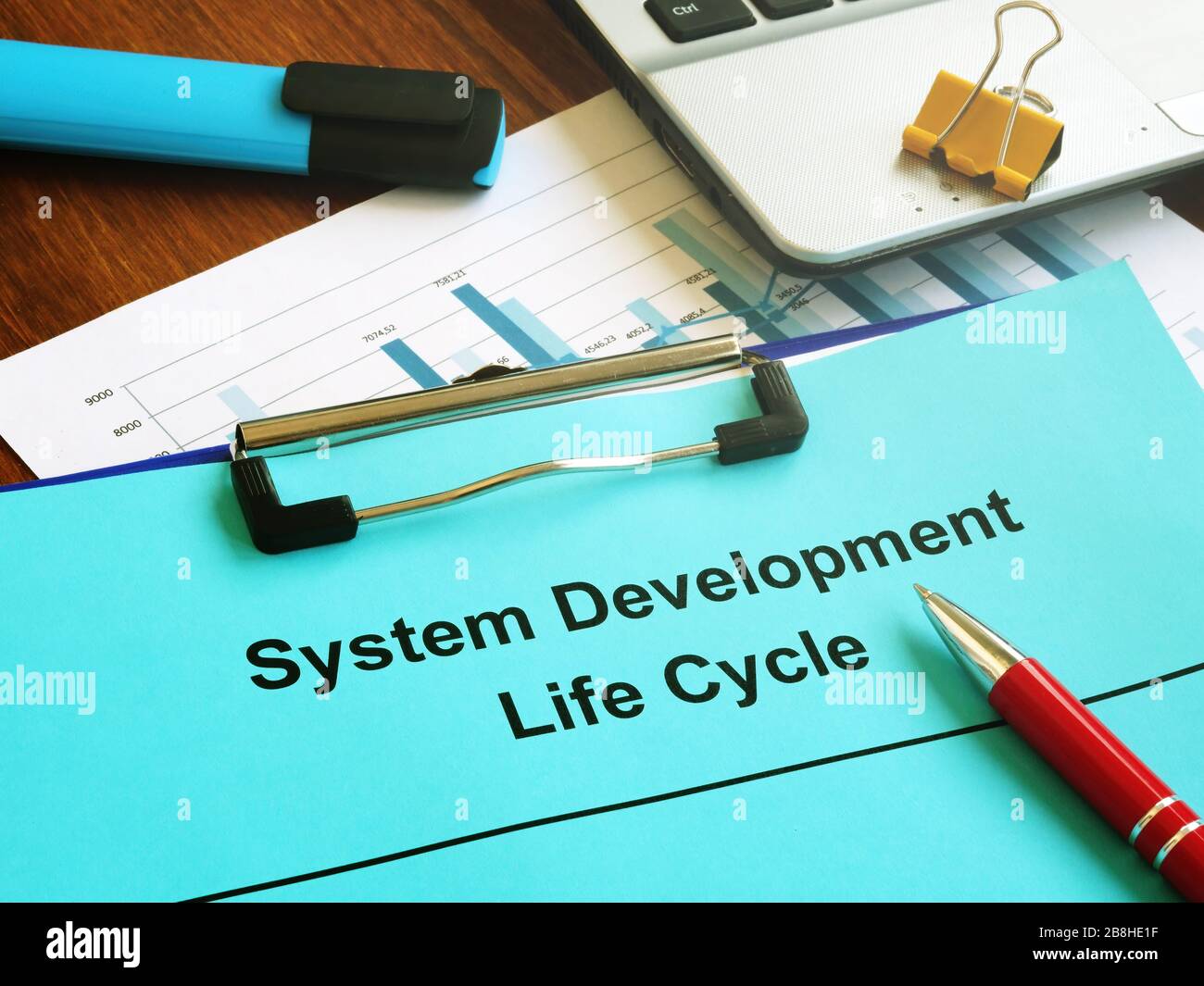 System Development Life Cycle SDLC papers and clipboard Stock Photo - Alamy