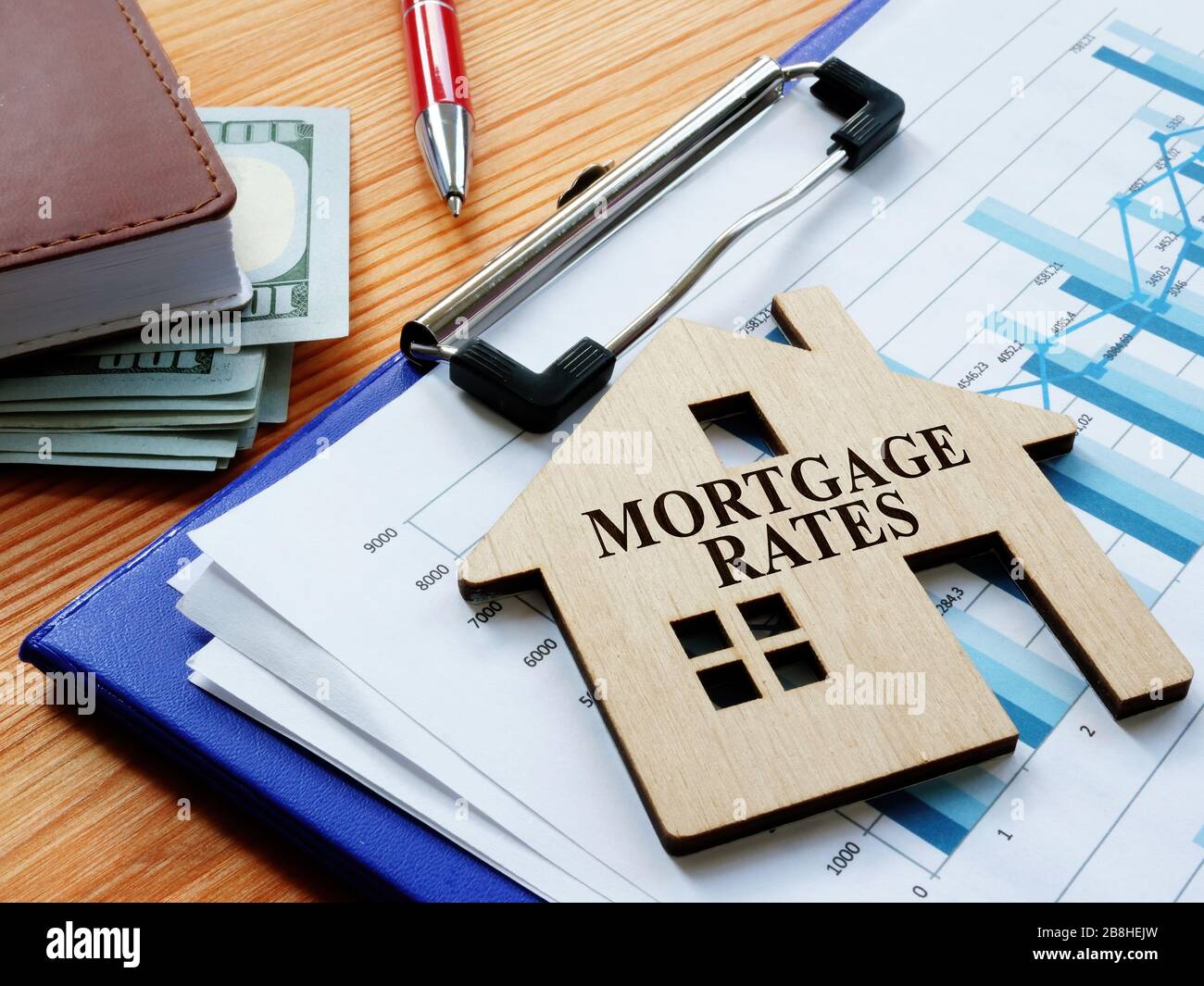 Mortgage rates sign on the home and charts Stock Photo - Alamy
