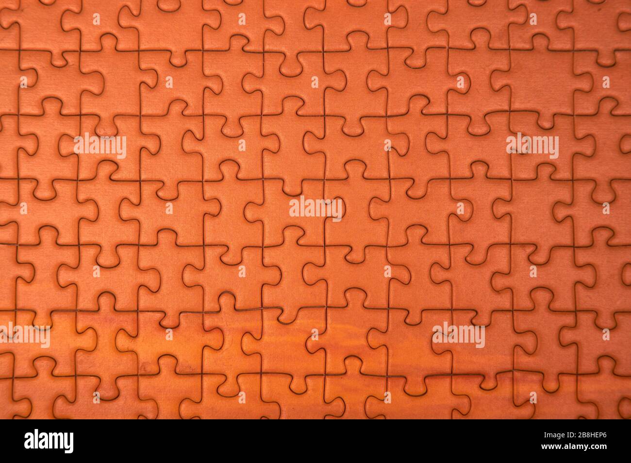 Puzzle in orange Stock Photo - Alamy