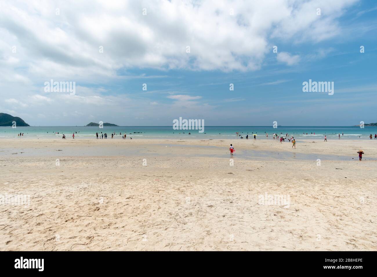 People take a dip in the sea and stroll on the white sand Stock Photo ...