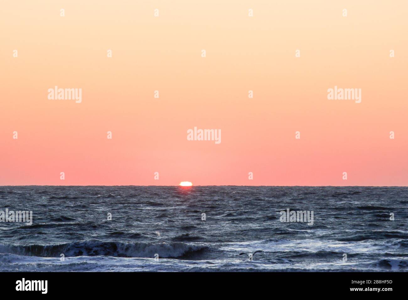 Sun Appearing Over The Horizon High Resolution Stock Photography and ...