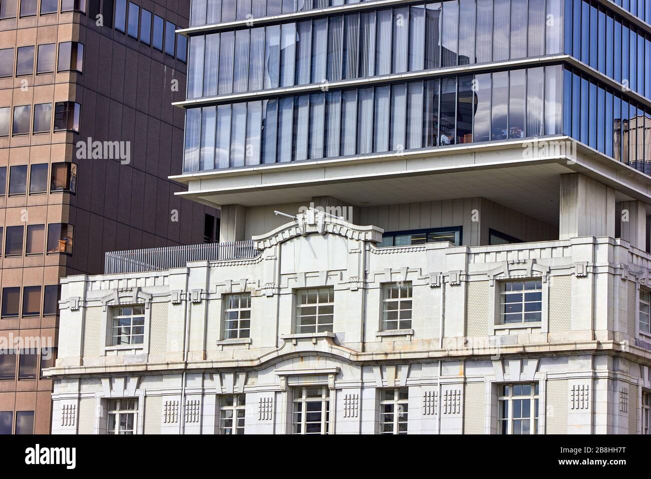 Modern office building on top of old building Stock Photo - Alamy