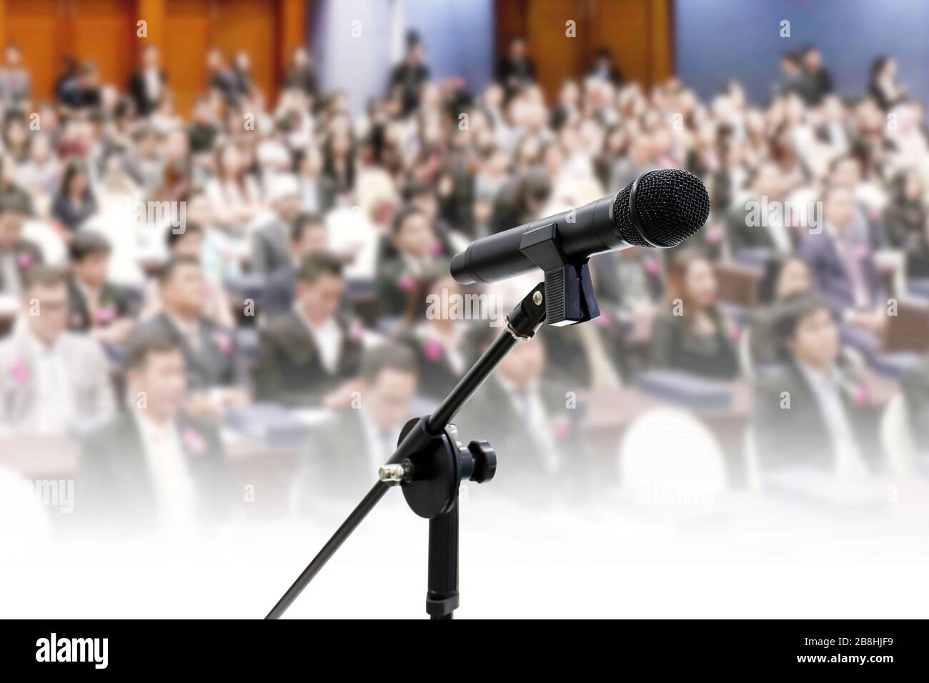 Microphone close up on Blurred many people seminar Meeting room ...