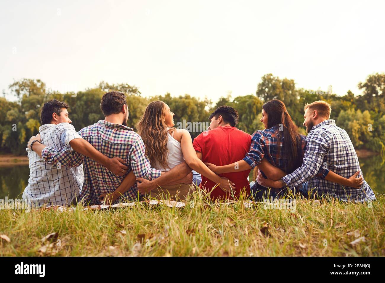 Happy friends in huddle hi-res stock photography and images - Alamy