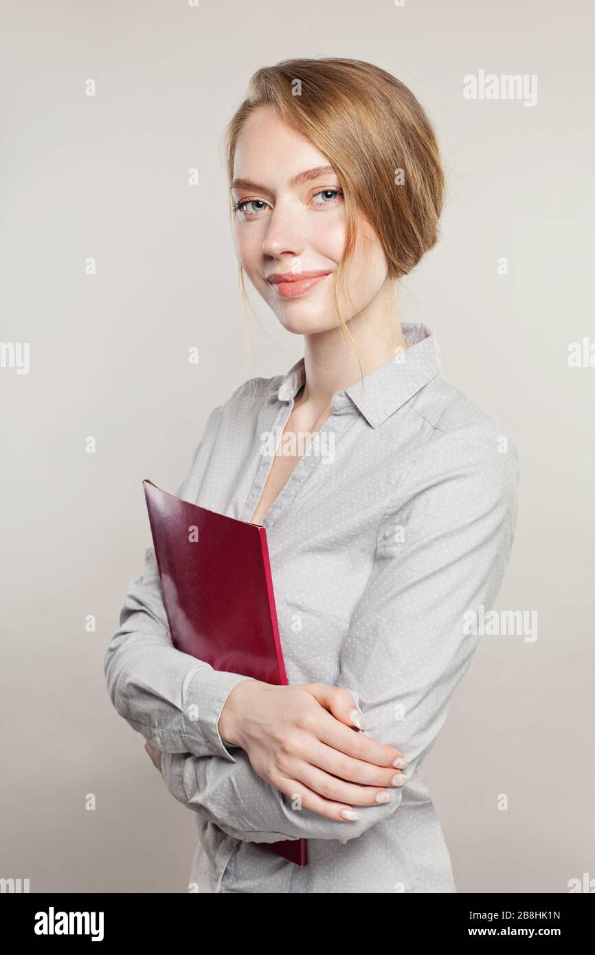 Successful smart woman with documents on white Stock Photo - Alamy