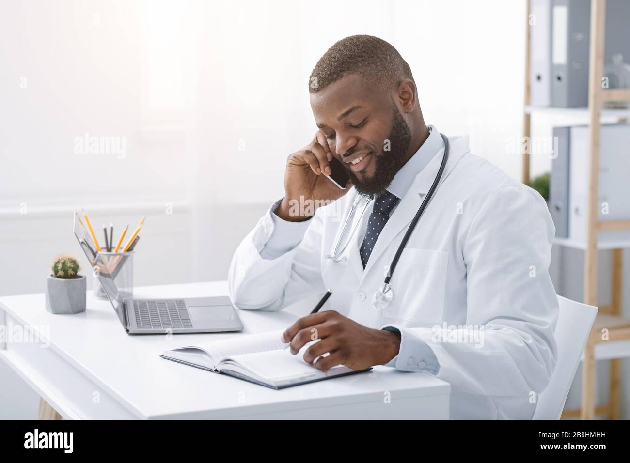 Male patient talking on laptop hi-res stock photography and images - Alamy