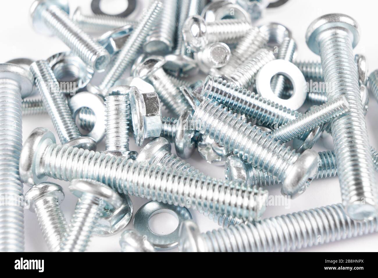 Metal bolts and nuts in a row background. Chromed screw bolts and nuts ...