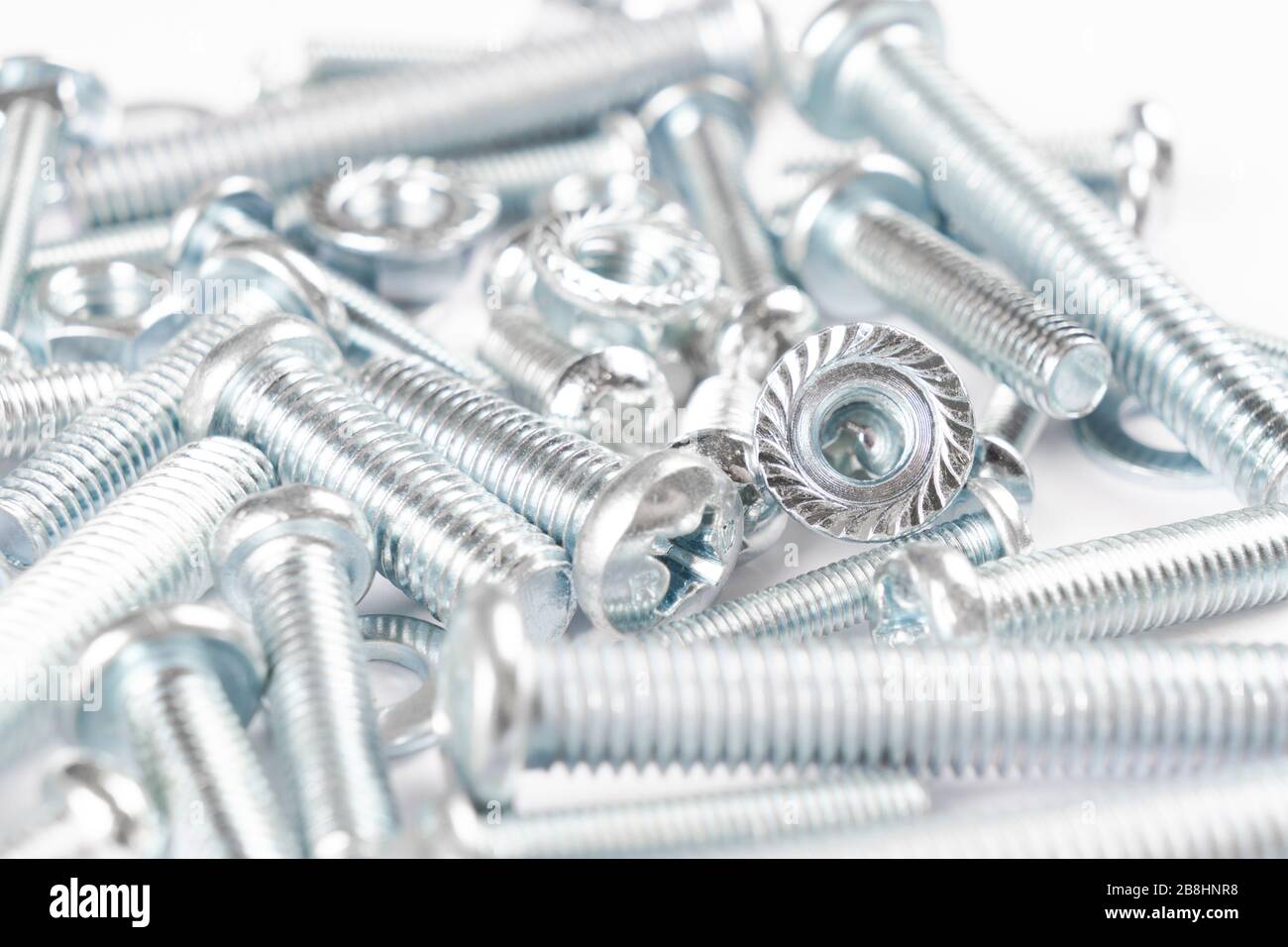 Metal bolts and nuts in a row background. Chromed screw bolts and nuts ...
