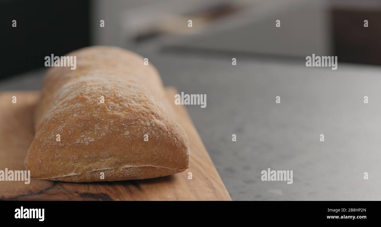 ciabatta bread on olive board, wide photo Stock Photo - Alamy