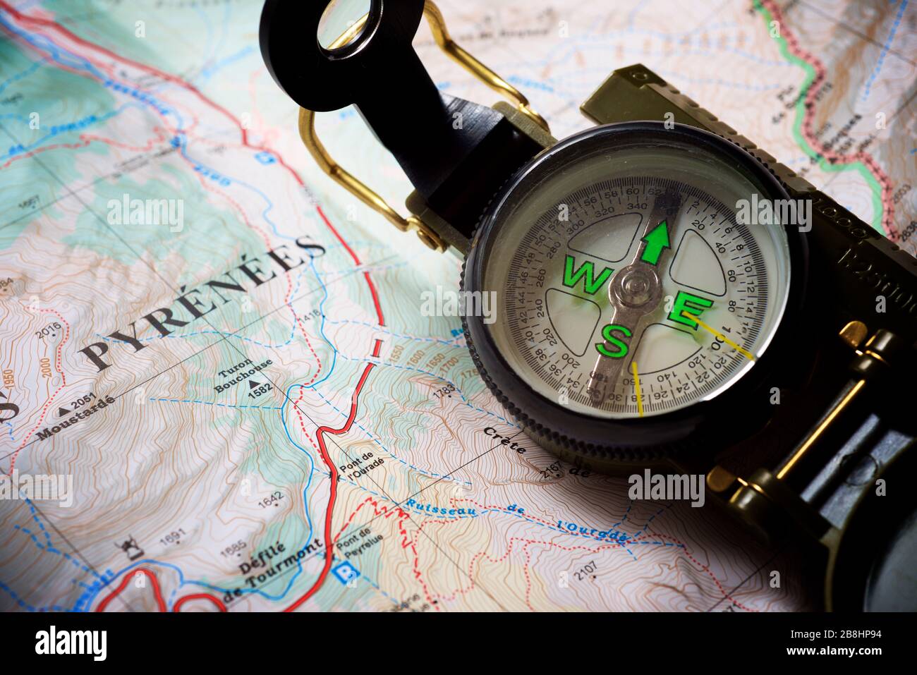 Compass on a cartographic map of the Pyrenees Stock Photo - Alamy