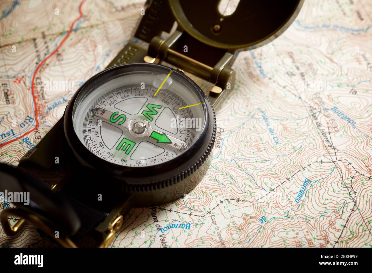 Compass on a cartographic map Stock Photo - Alamy