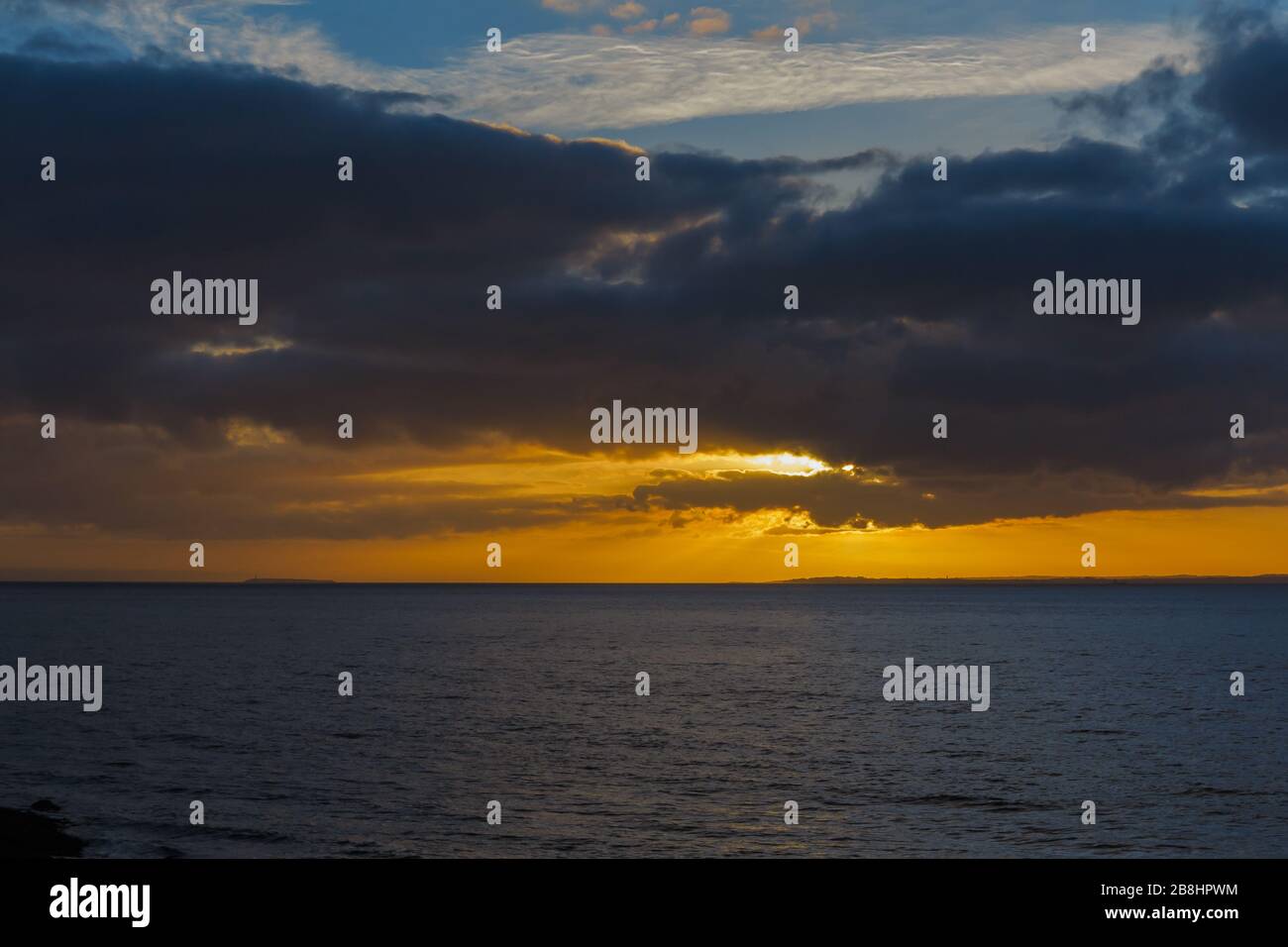 The about to set over the Bristol channel Stock Photo - Alamy
