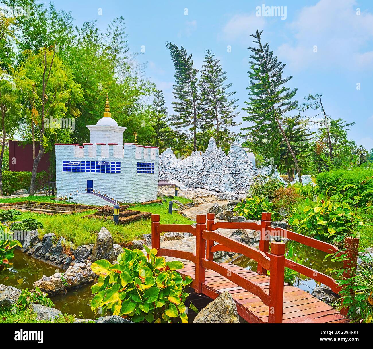 Walk the small bridge and observe the scenic Nepal garden with juicy ...