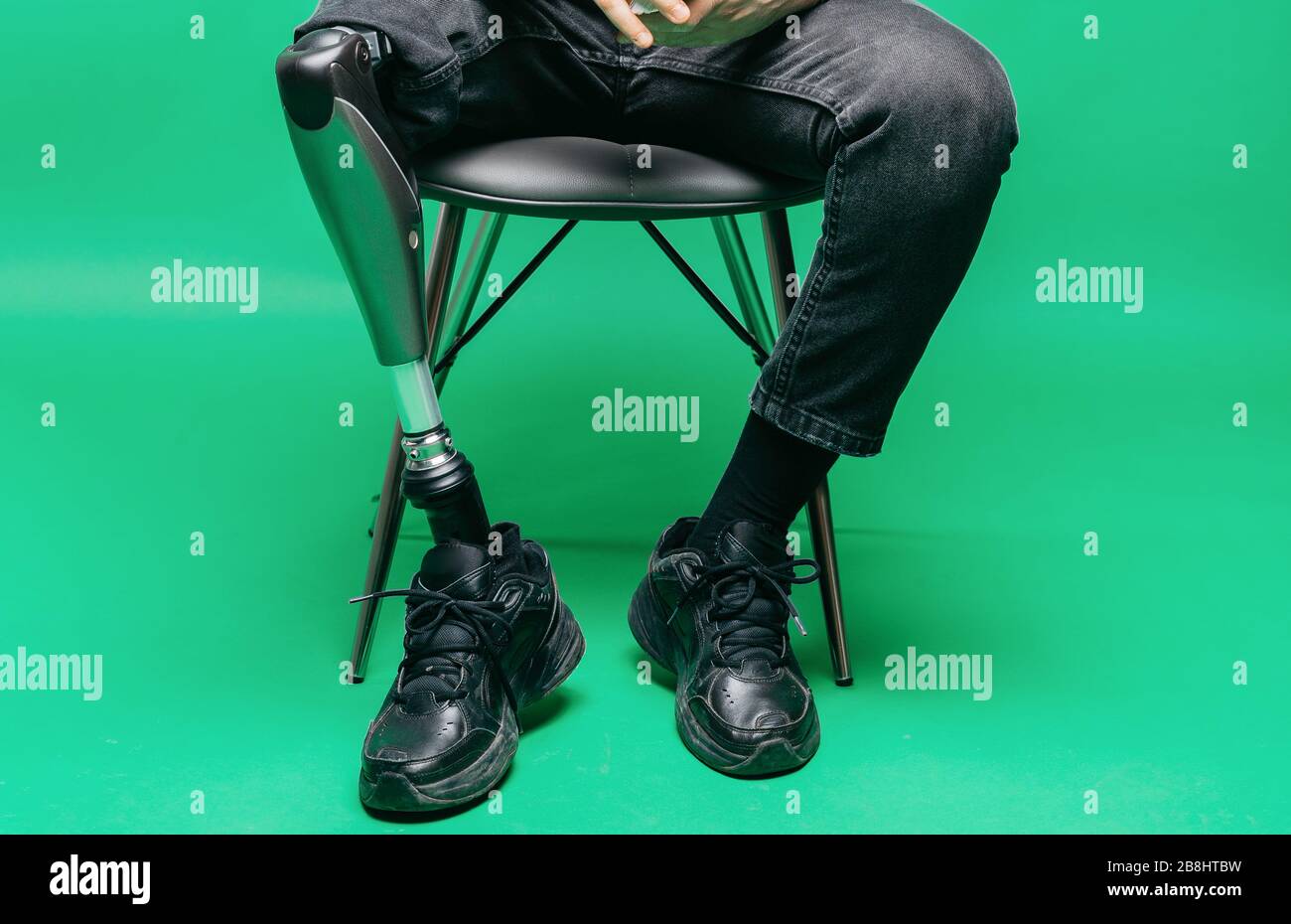 Cropped view of disabled young man with prosthetic leg, artificial limb ...