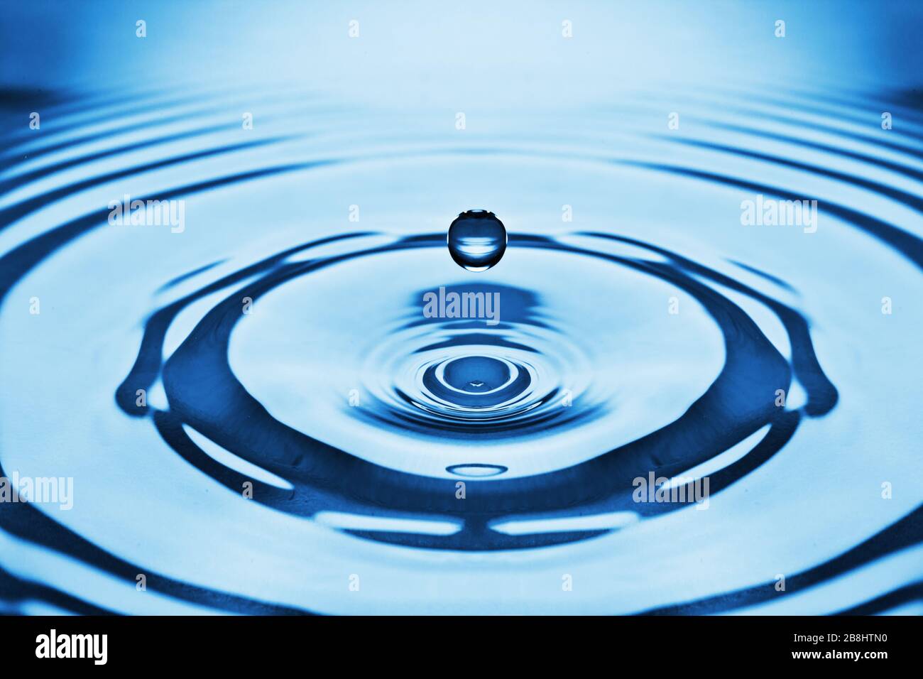 The round transparent drop of water, falls downwards Stock Photo - Alamy