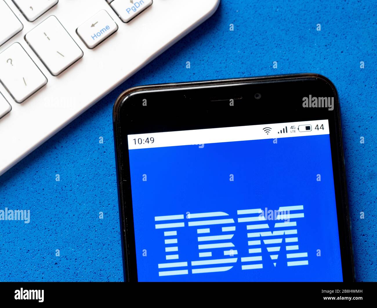 In this photo illustration IBM logo is seen displayed on a smartphone ...