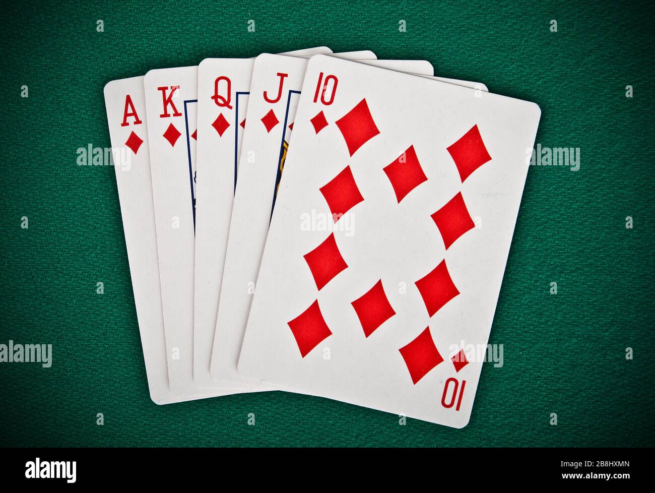 A royal straight flush playing cards poker hand Stock Photo - Alamy