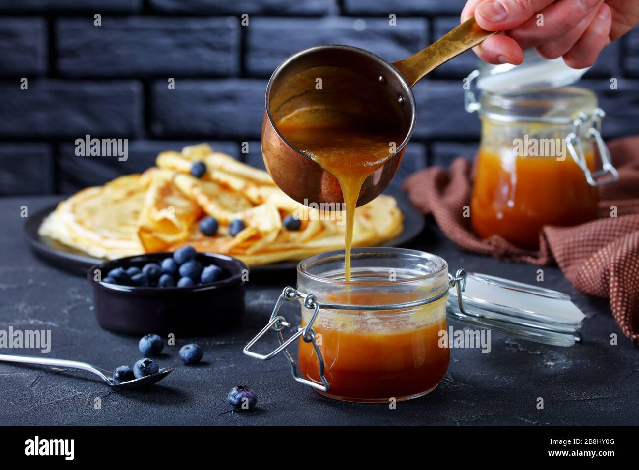 Syrup pouring into saucepan hi-res stock photography and images - Alamy