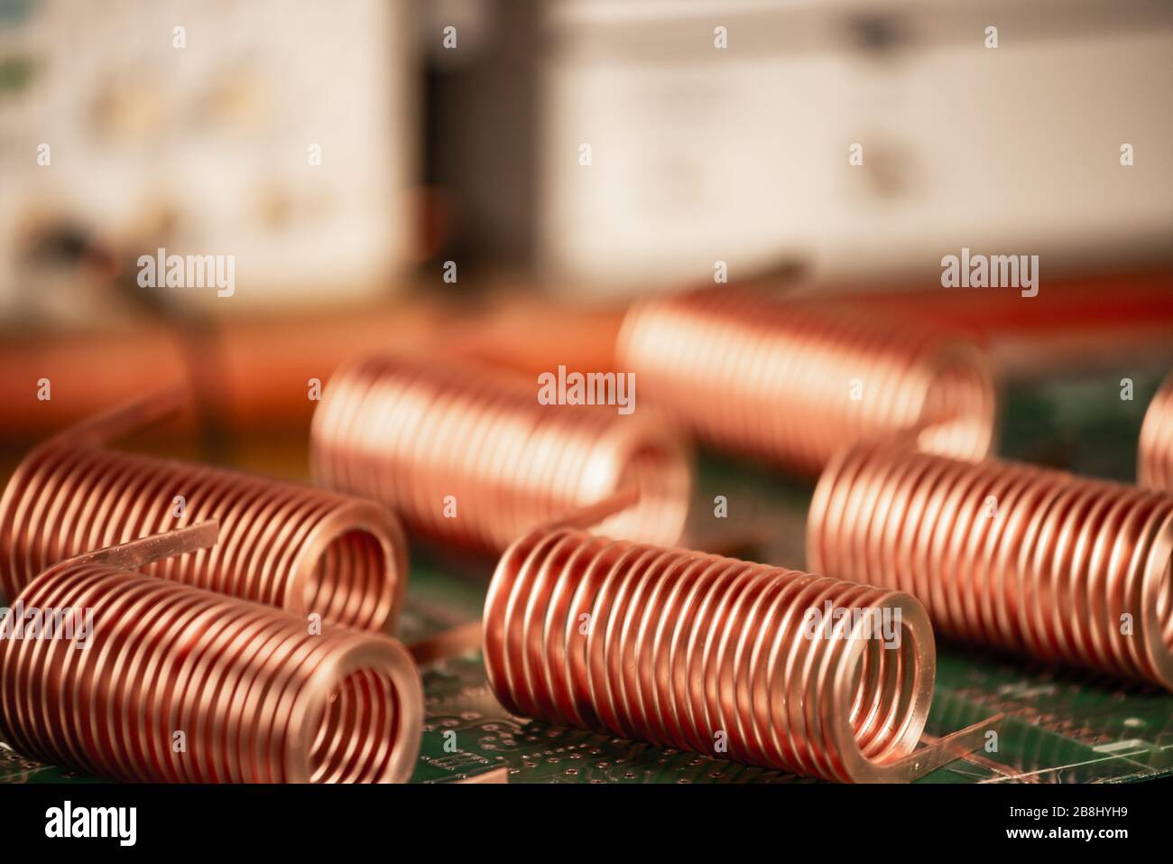 Close-up of high-frequency copper wire on green microcircuit on ...