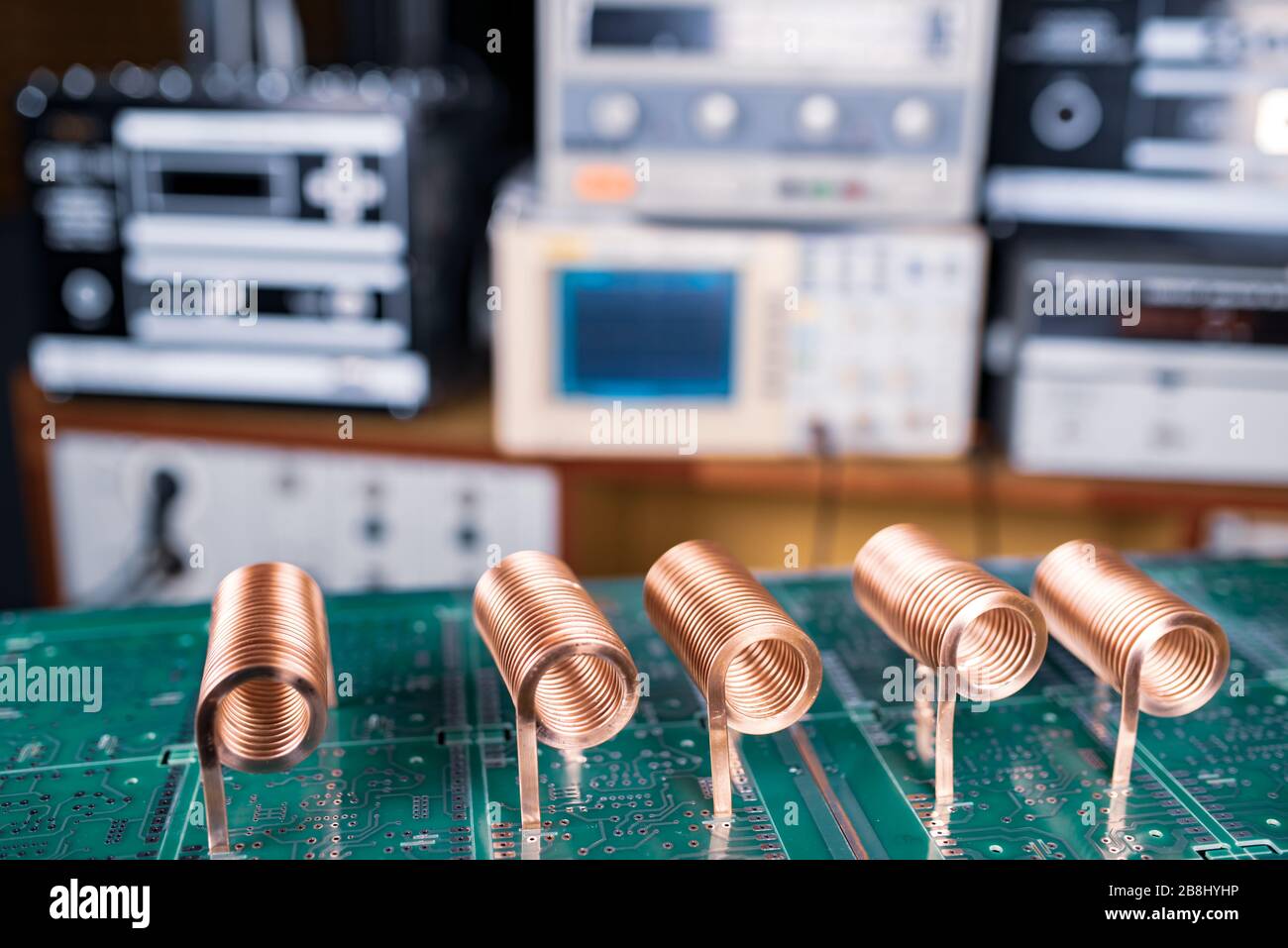 Close-up of high-frequency copper wire on green microcircuit on ...