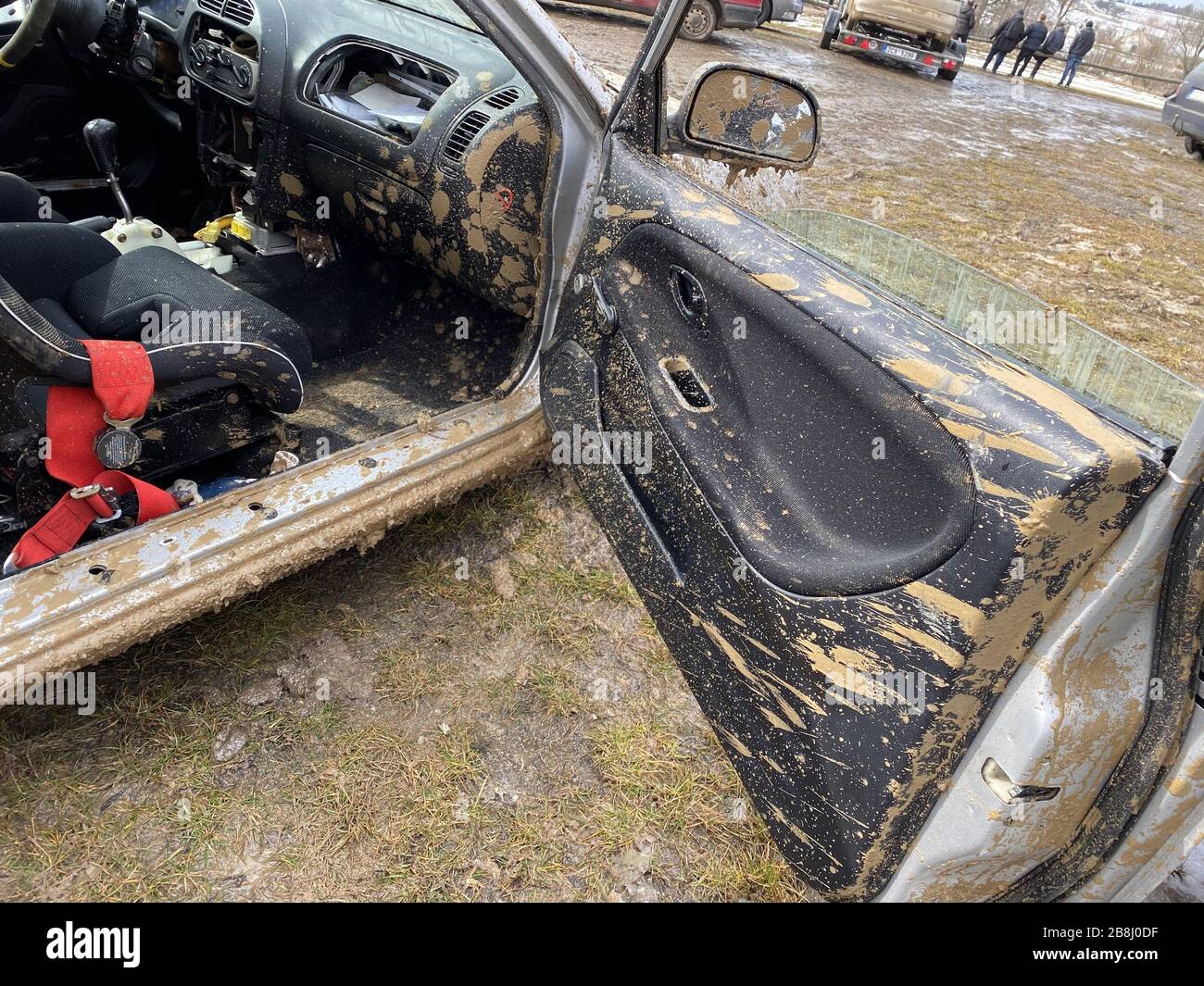 The detail of the car completely dirty by mud after the drag race on a ...