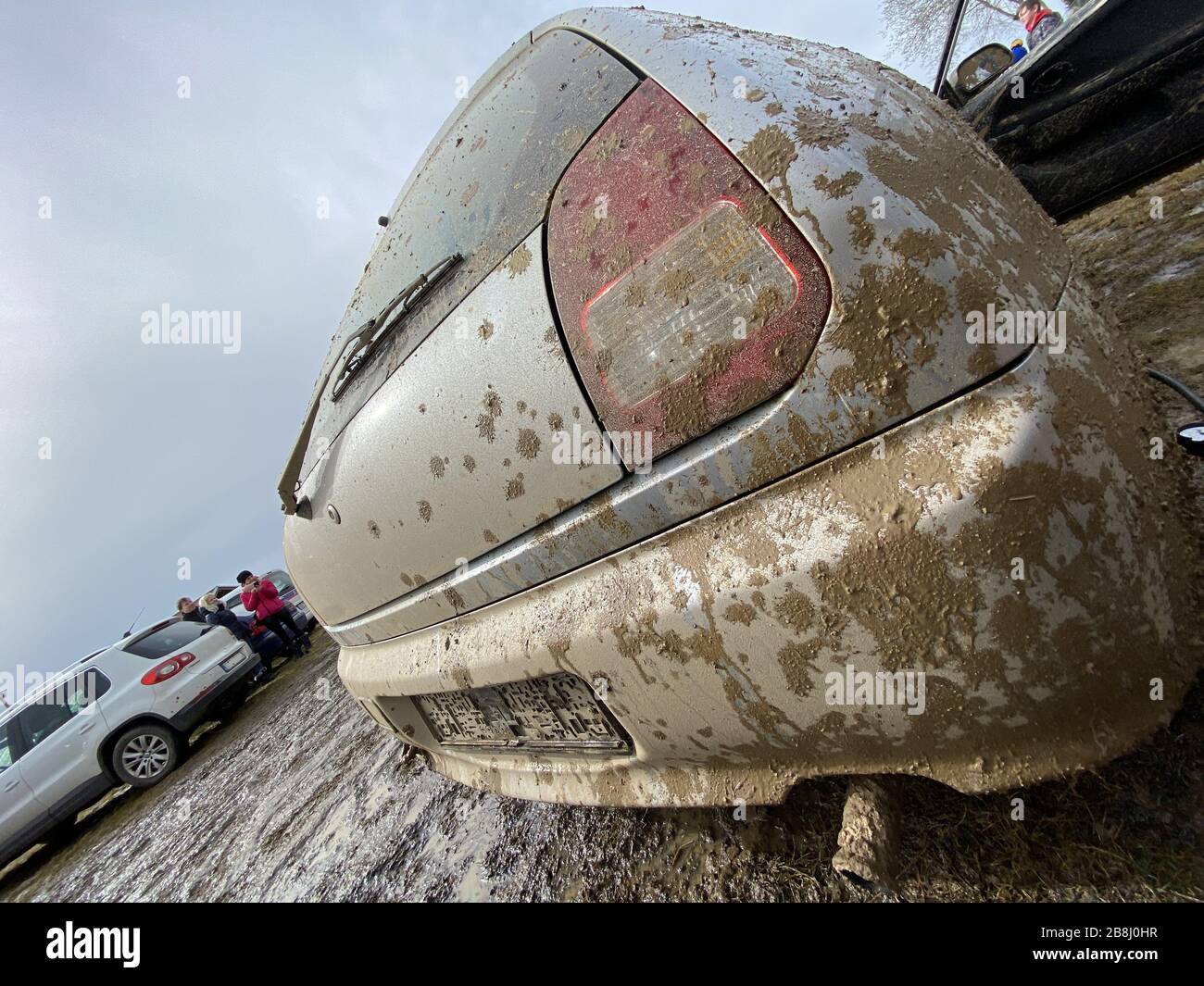 The detail of the car completely dirty by mud after the drag race on a ...