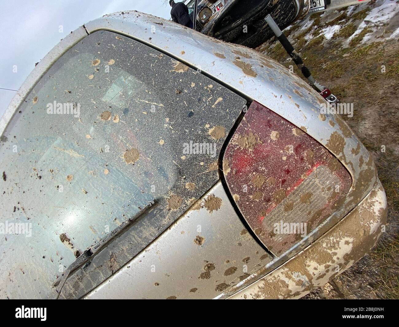 The detail of the car completely dirty by mud after the drag race on a ...