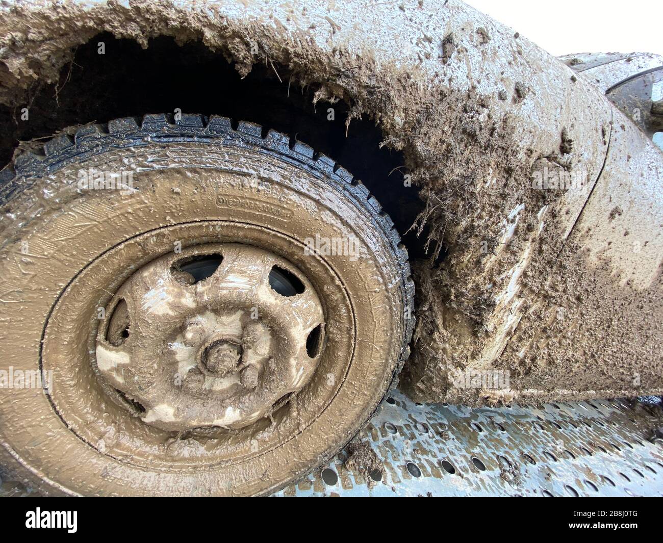 The detail of the car completely dirty by mud after the drag race on a ...
