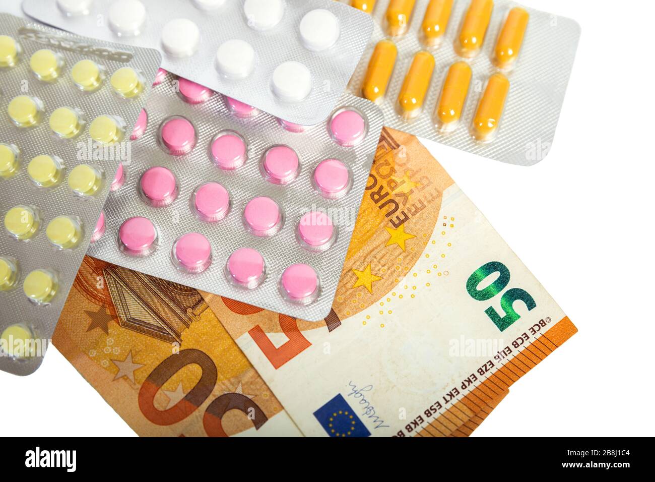 Pills and capsules in blisters on euro banknotes. The concept of ...