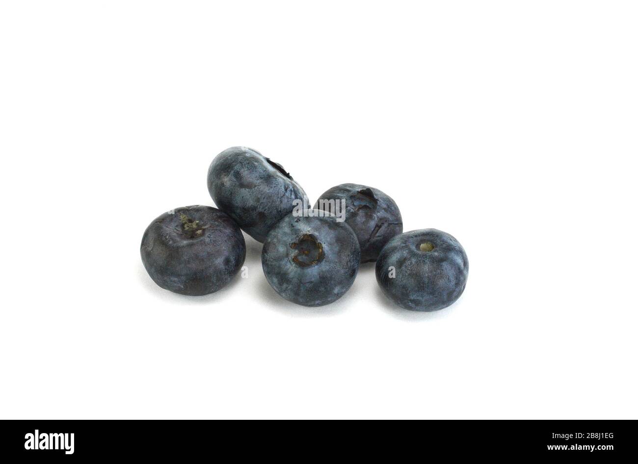 Sweet blueberries isolated on white Stock Photo - Alamy