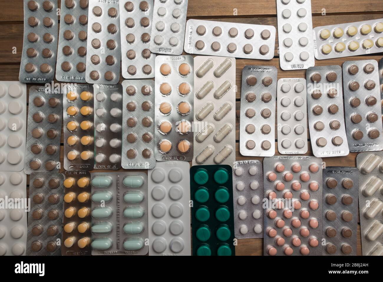 Closeup shot of different pills on table with tablets , pharmaceutical ...