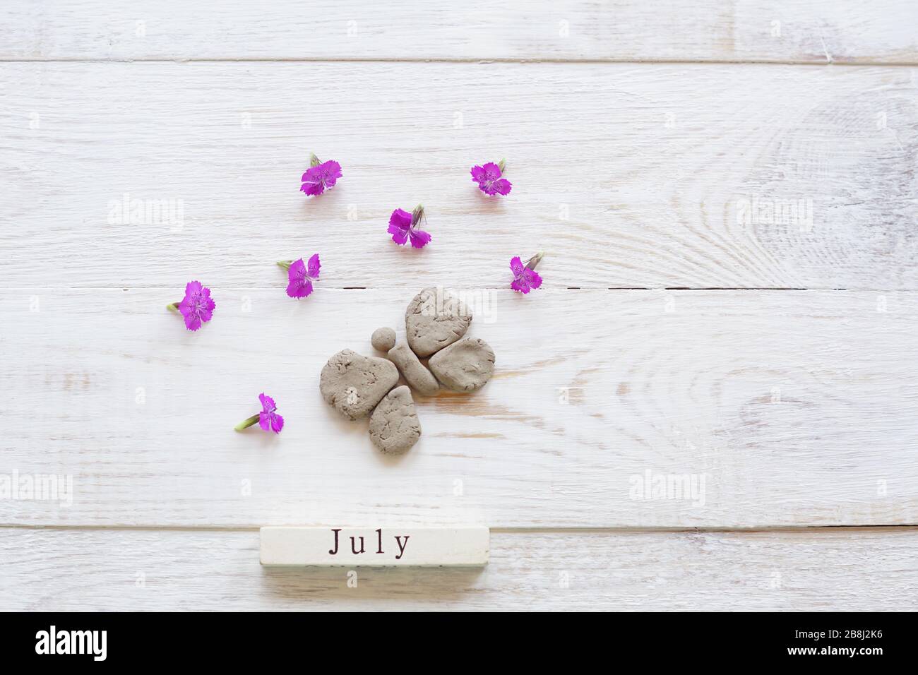 first day of July, colorful background with calendar, flowers and clay ...