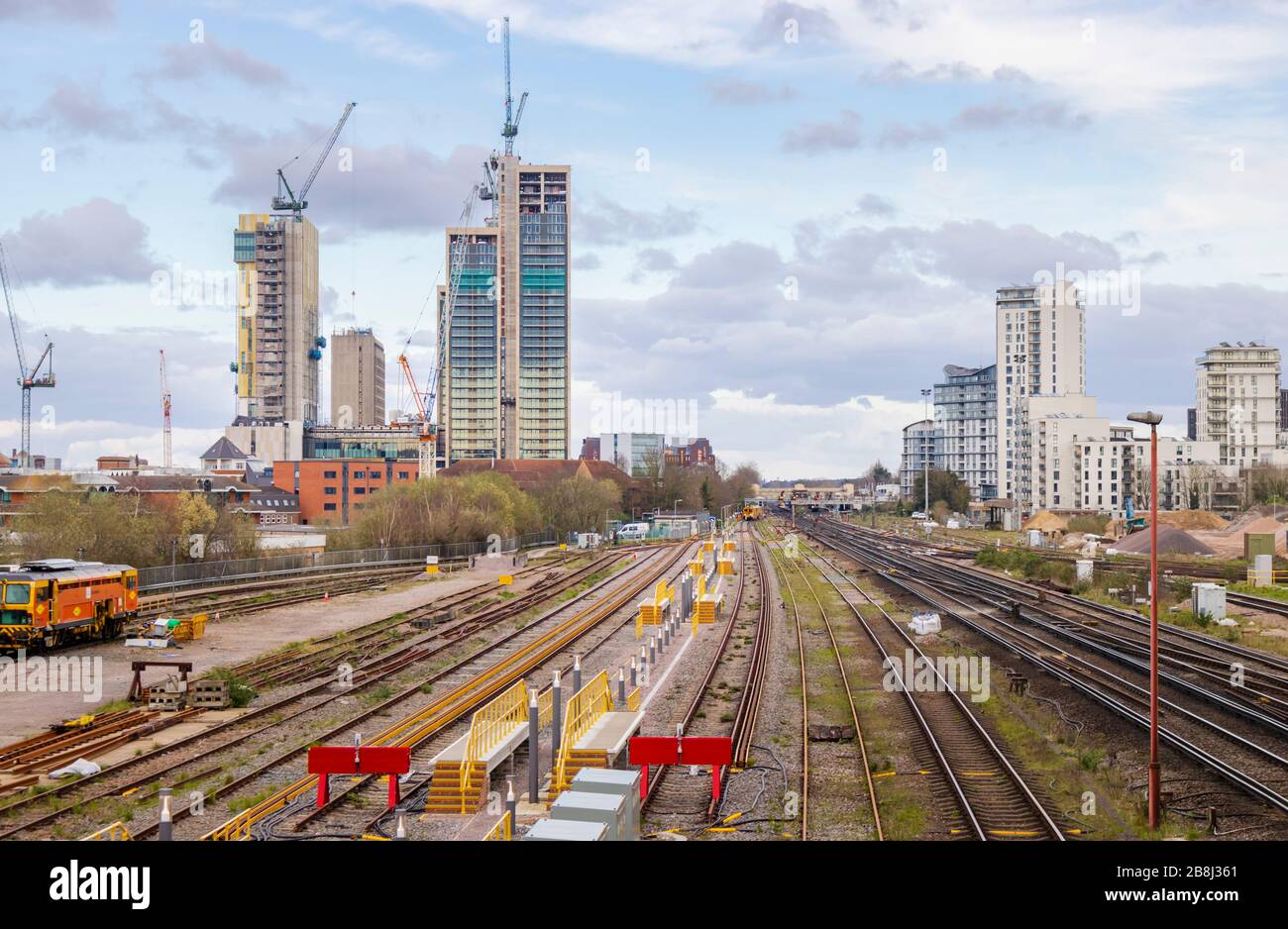 View along railway tracks towards Woking and the new skyline high rise ...