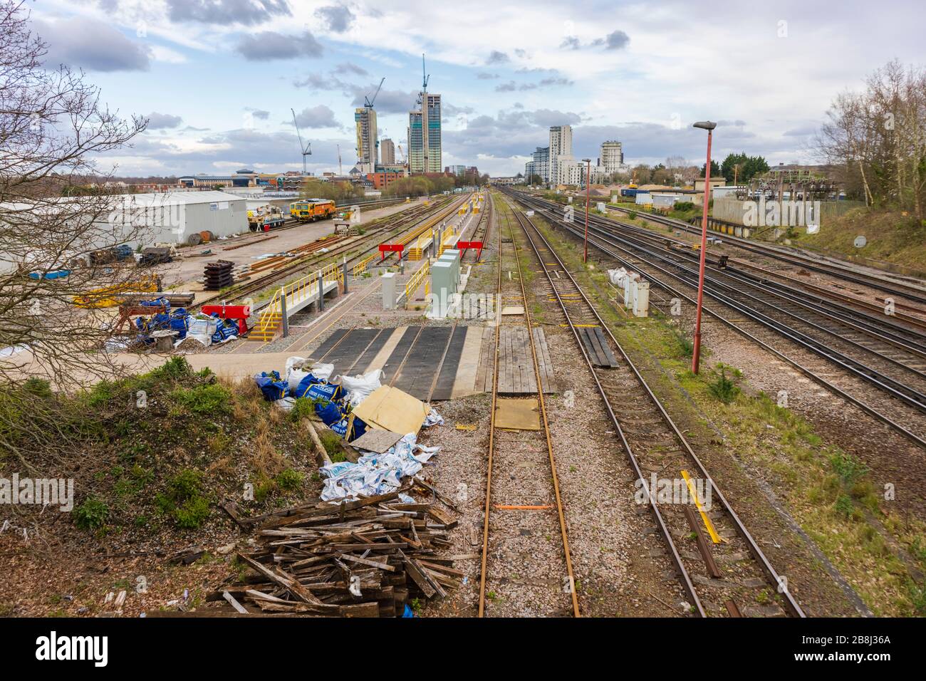 View along railway tracks towards Woking and the new skyline high rise ...