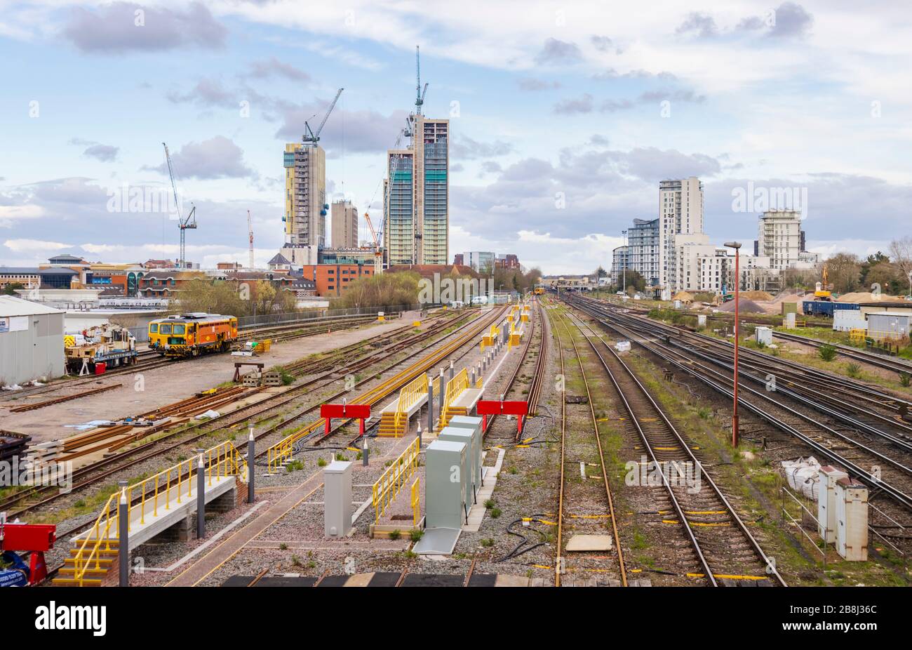 View along railway tracks towards Woking and the new skyline high rise ...