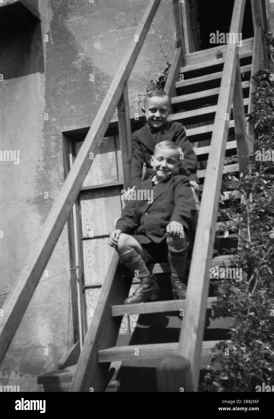 1940s, historical, two rascals, two young schoolboys, brothers, sitting ...