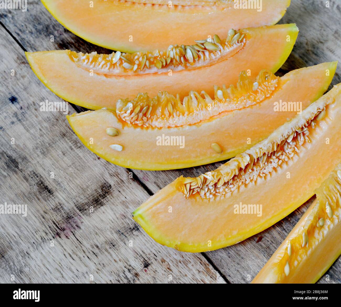 melon slices on the rustic wooden board Stock Photo - Alamy