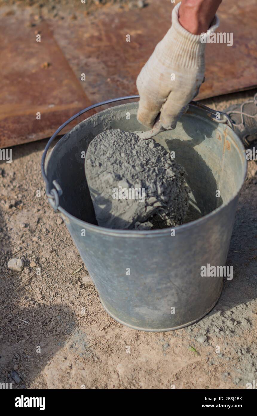 construction worker mixing concrete cement and sand by spade Stock ...