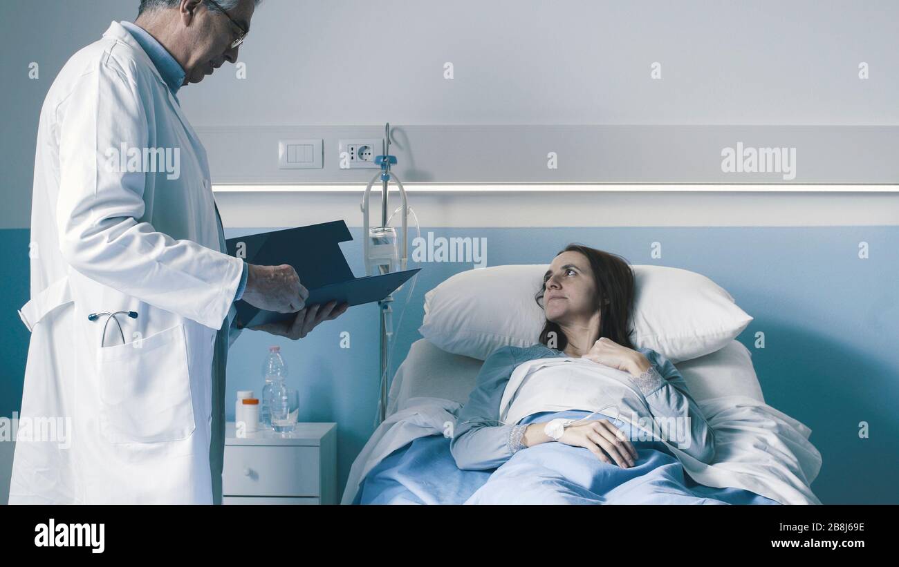 Professional doctor visiting patient checking hi-res stock photography ...