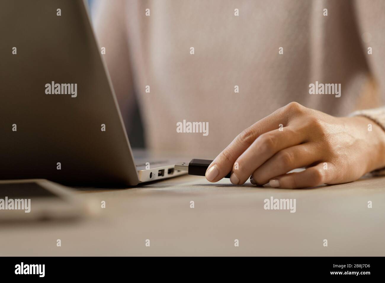 Woman plugging computer hi-res stock photography and images - Alamy