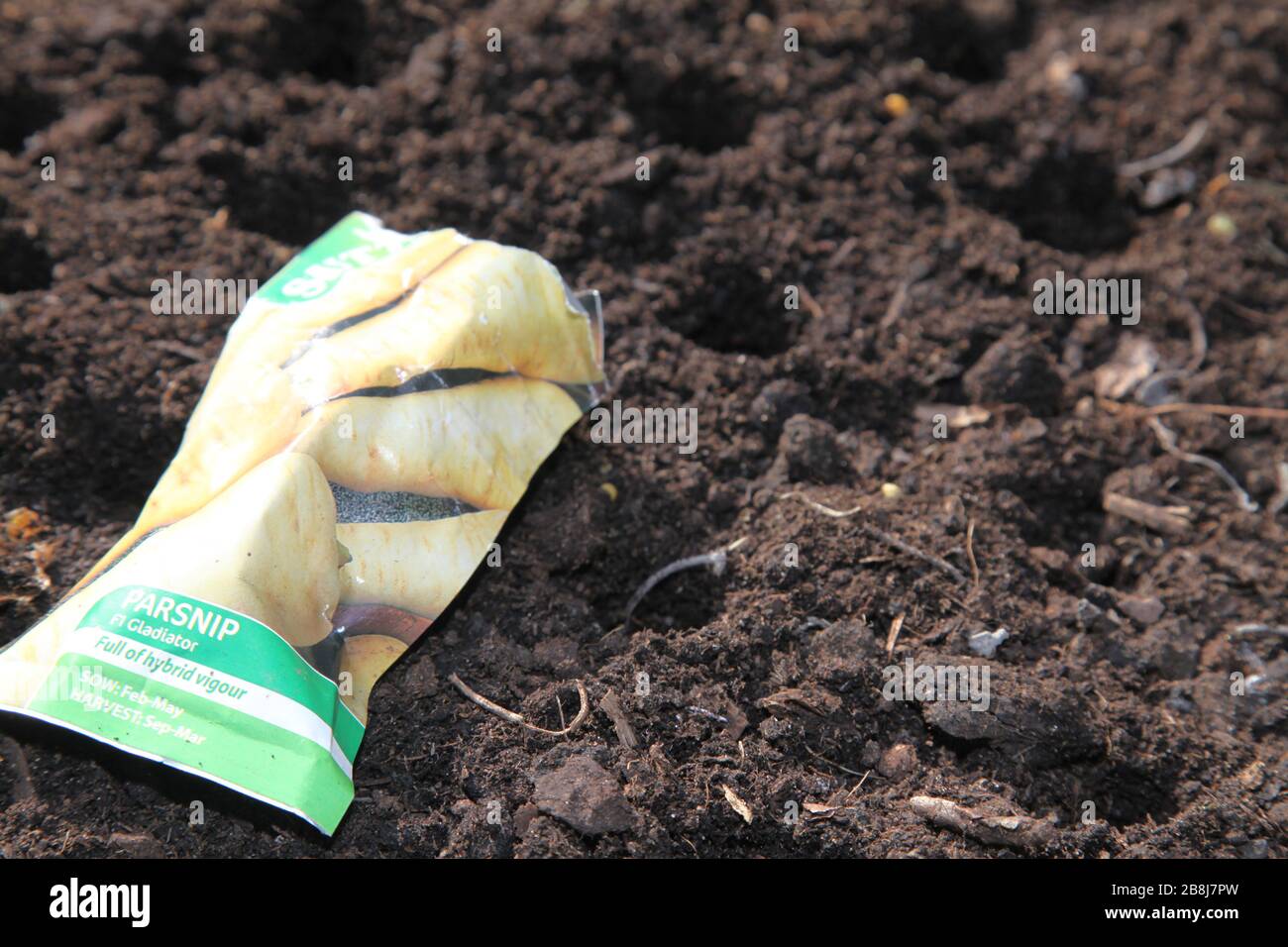 Seed packet on mud hi-res stock photography and images - Alamy