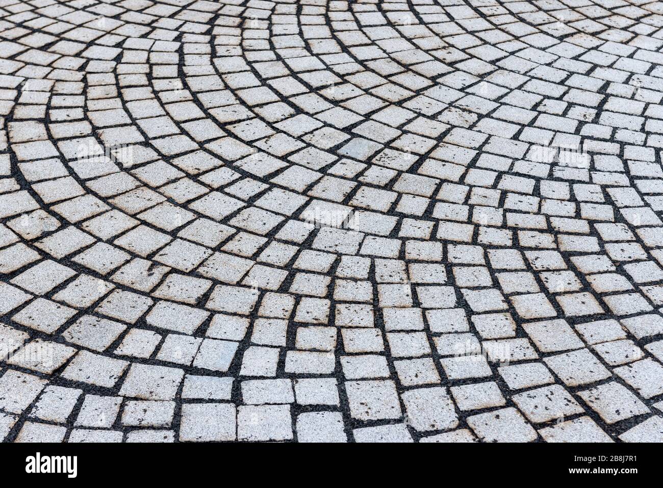sidewalk covered with square paving stones Stock Photo - Alamy