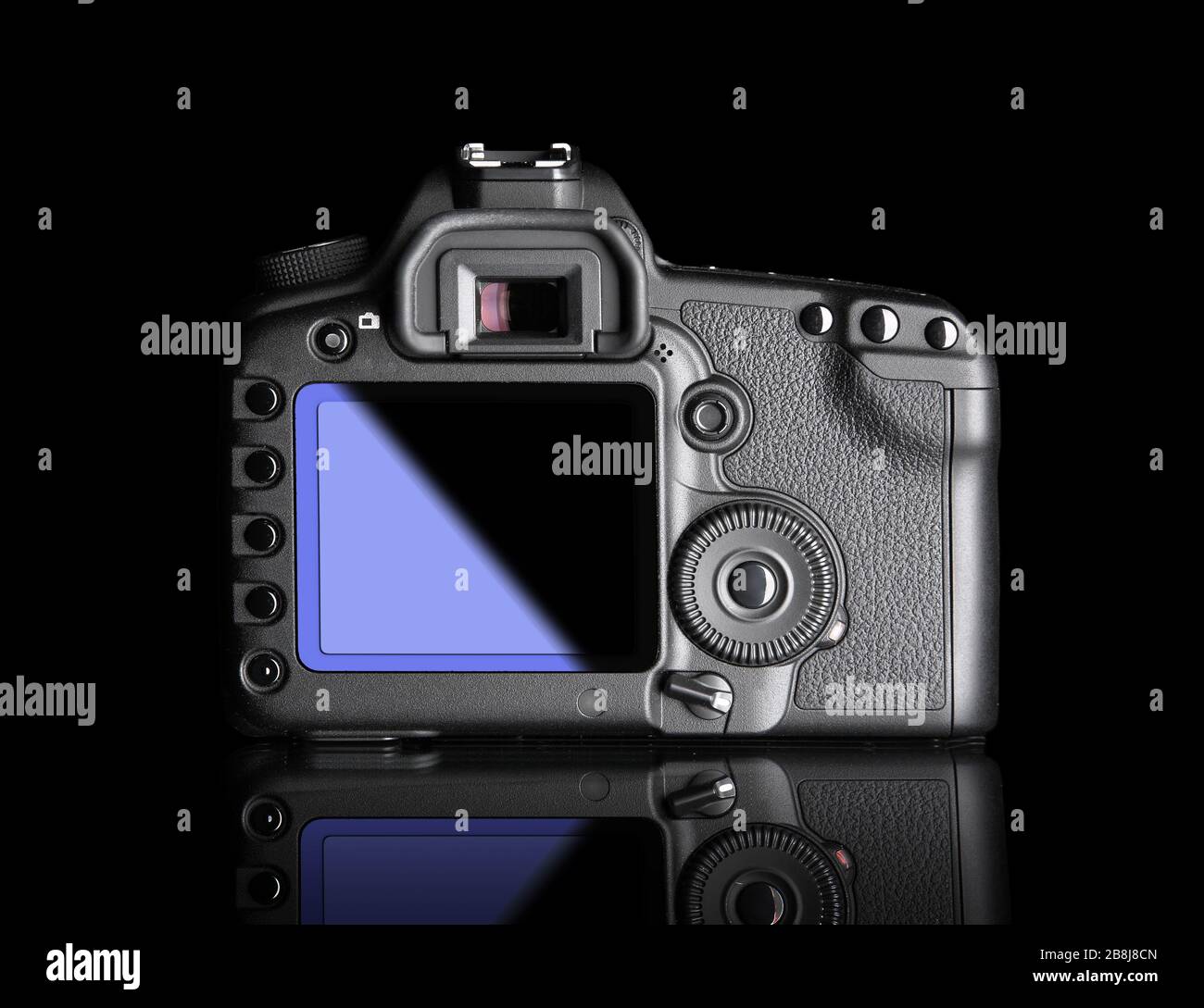 Professional Digital Camera, back view. It is isolated on black ...