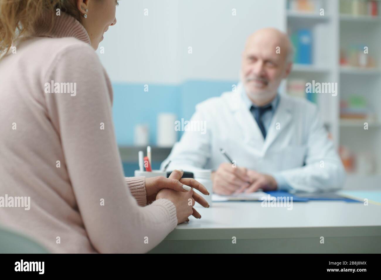 Senior doctor and female patient meeting in the office, healthcare and ...
